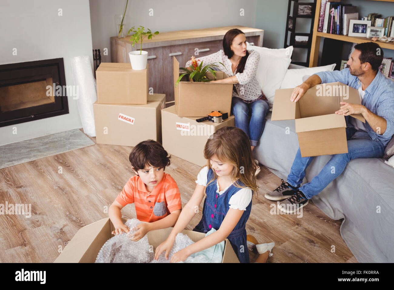 Unpacking cardboard boxes hi-res stock photography and images - Alamy