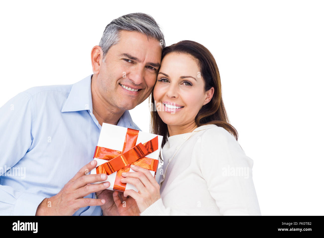 Cute couple holding box Stock Photo - Alamy