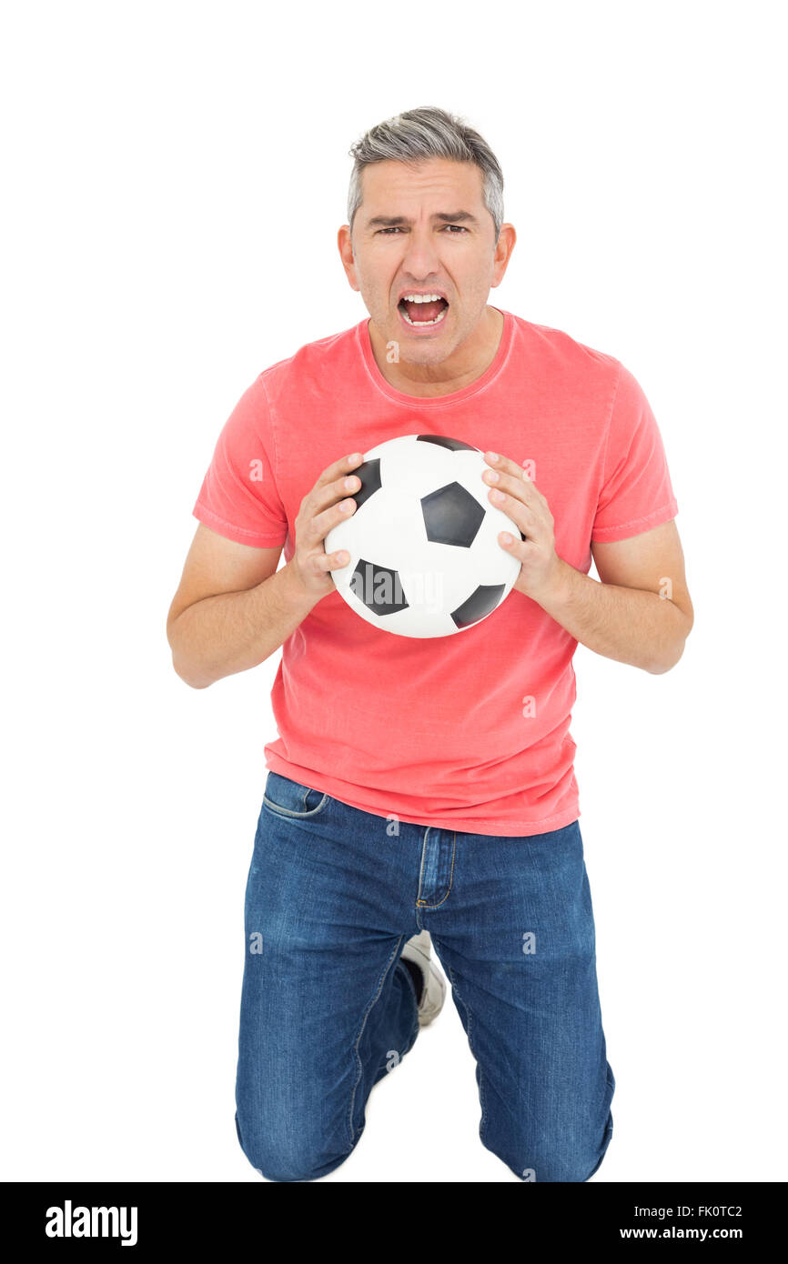 Mature man holding soccer Cut Out Stock Images & Pictures - Alamy