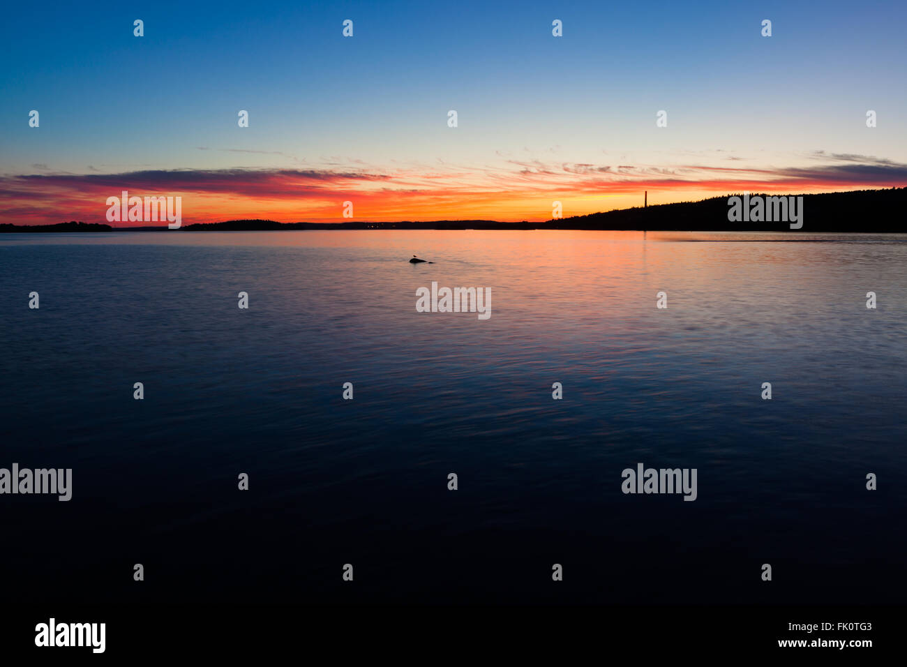 Calm sunset and clouds over lake Stock Photo - Alamy