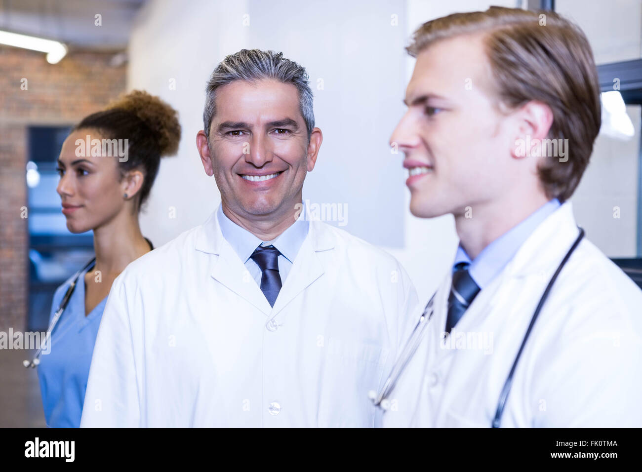 Portrait of male doctor smiling in hospital Stock Photo - Alamy