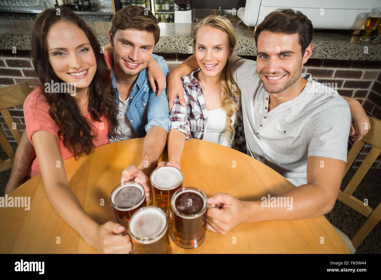 Friends toasting with beers Stock Photo - Alamy