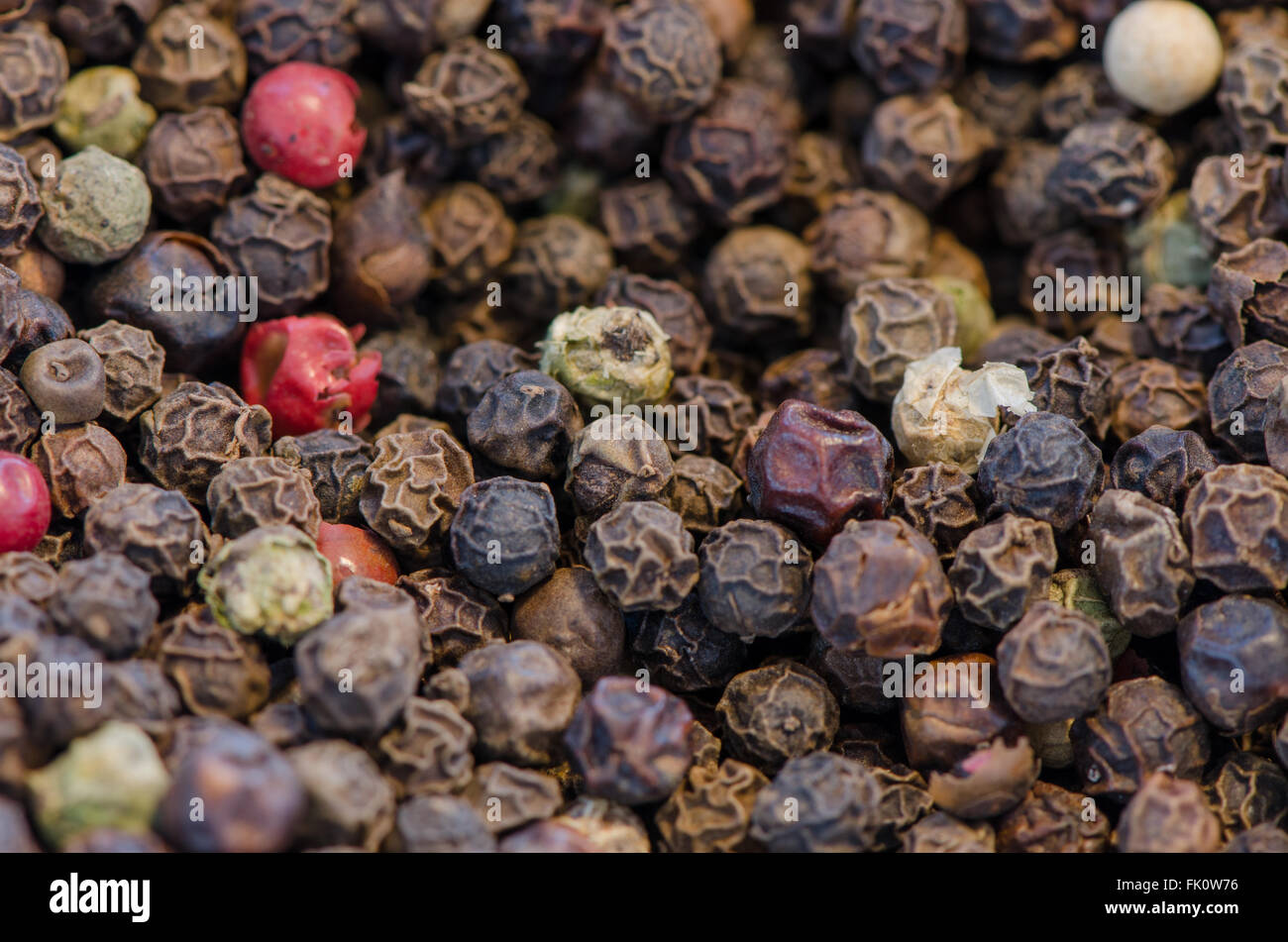 Multicolored pepper corn background image Stock Photo - Alamy