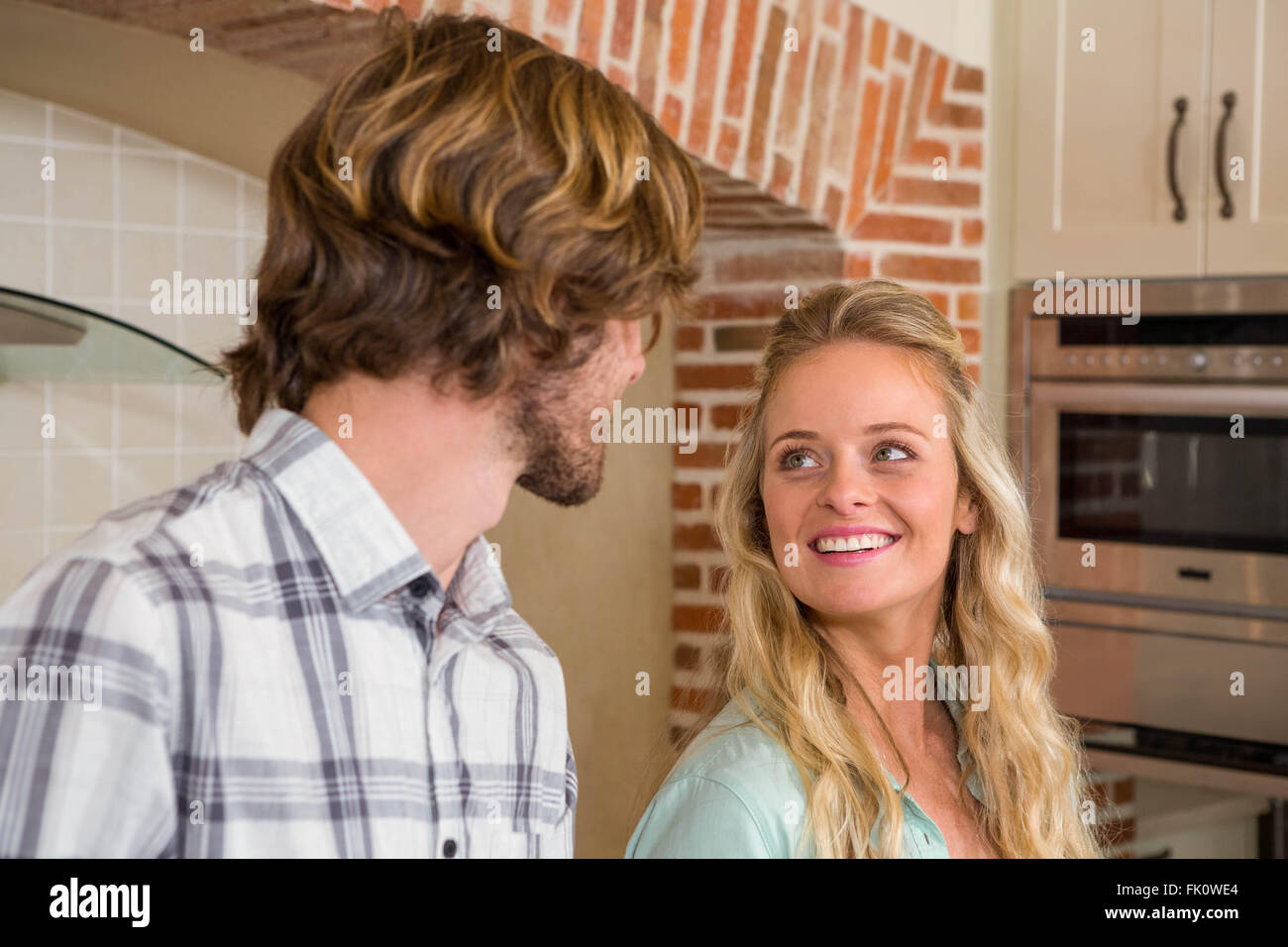 Cute couple lovingly looking at each other Stock Photo - Alamy