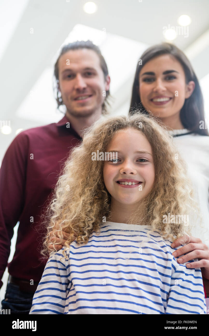 Happy family in shopping mall Stock Photo - Alamy