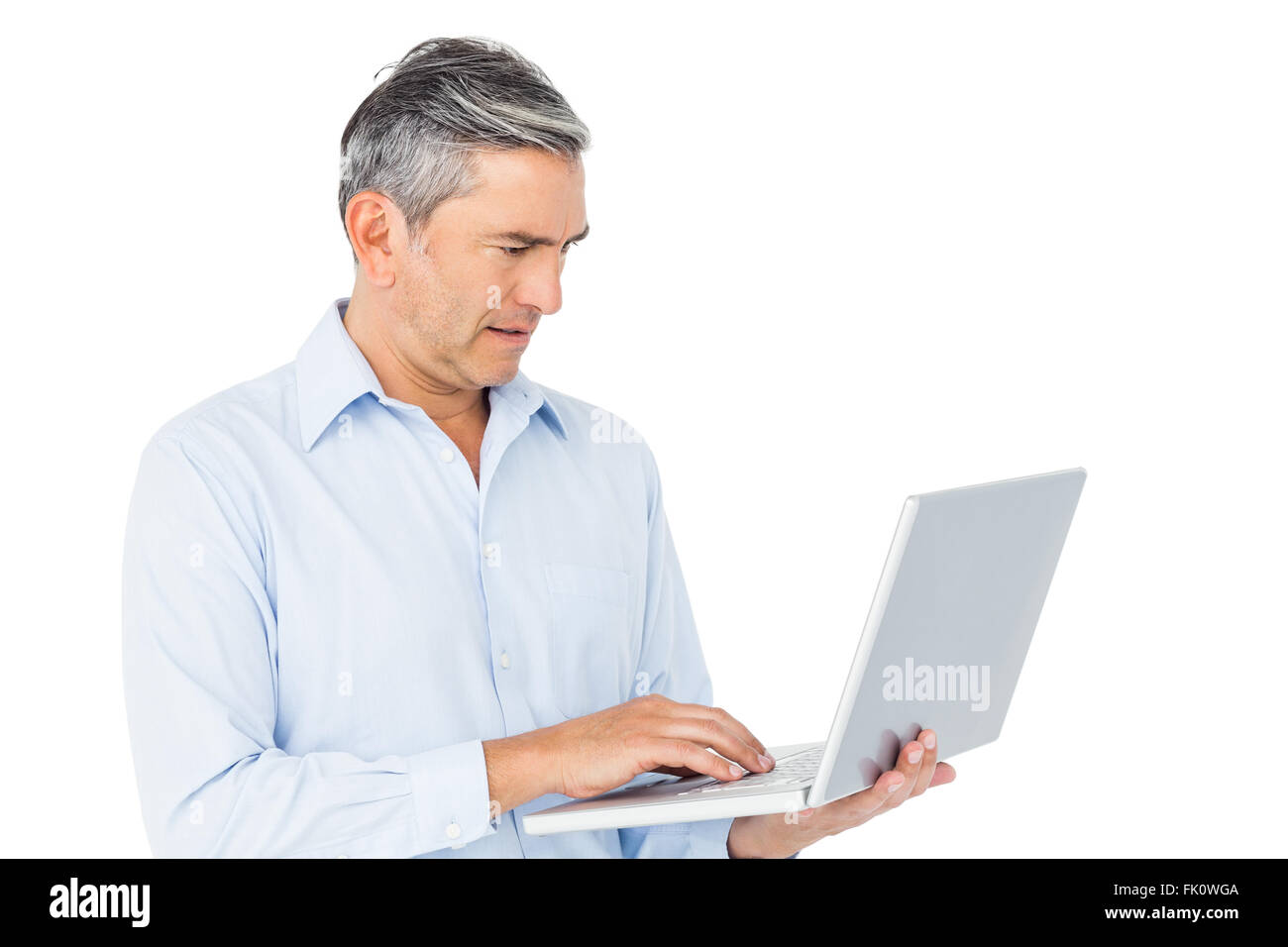 Smiling executive man typing laptop hi-res stock photography and images ...