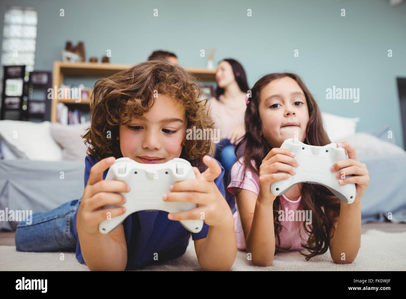Brother and sister playing video game hi-res stock photography and ...