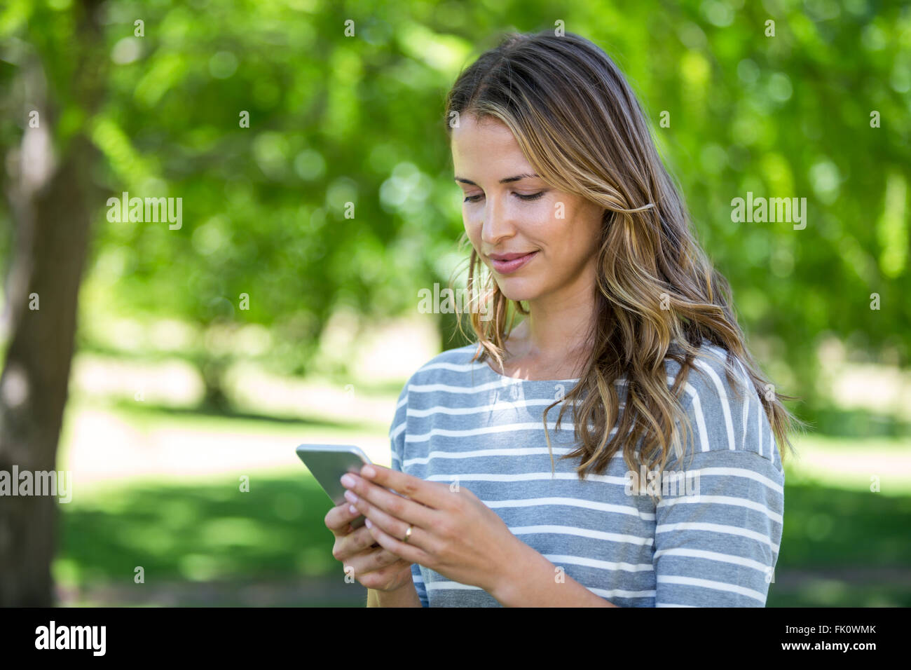 Woman using smartphone Stock Photo - Alamy