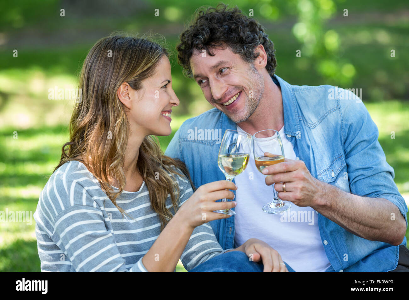 Couple drinking white wine Stock Photo - Alamy