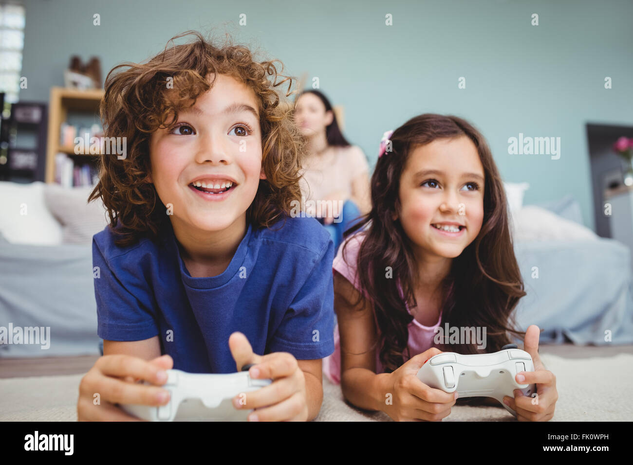 Brother and sister playing video game hi-res stock photography and ...