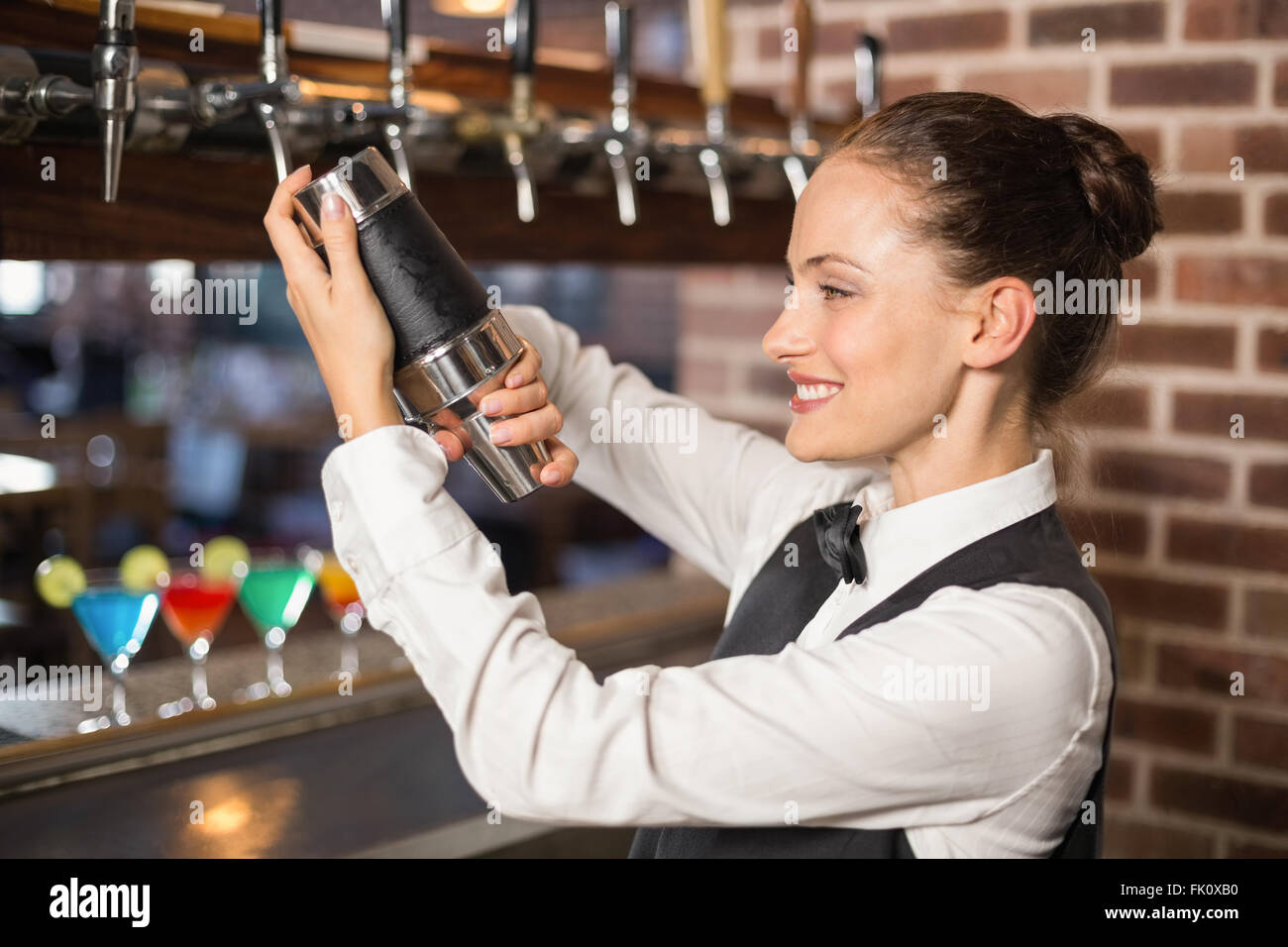 Barmaid shaking a cocktail Stock Photo - Alamy