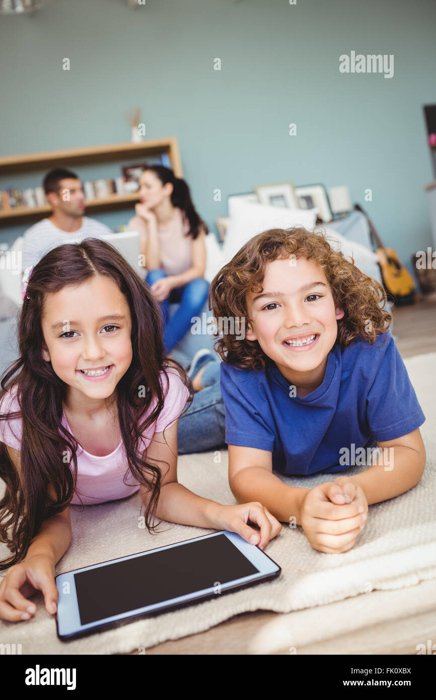Close-up portrait of happy siblings with digital tablet Stock Photo - Alamy