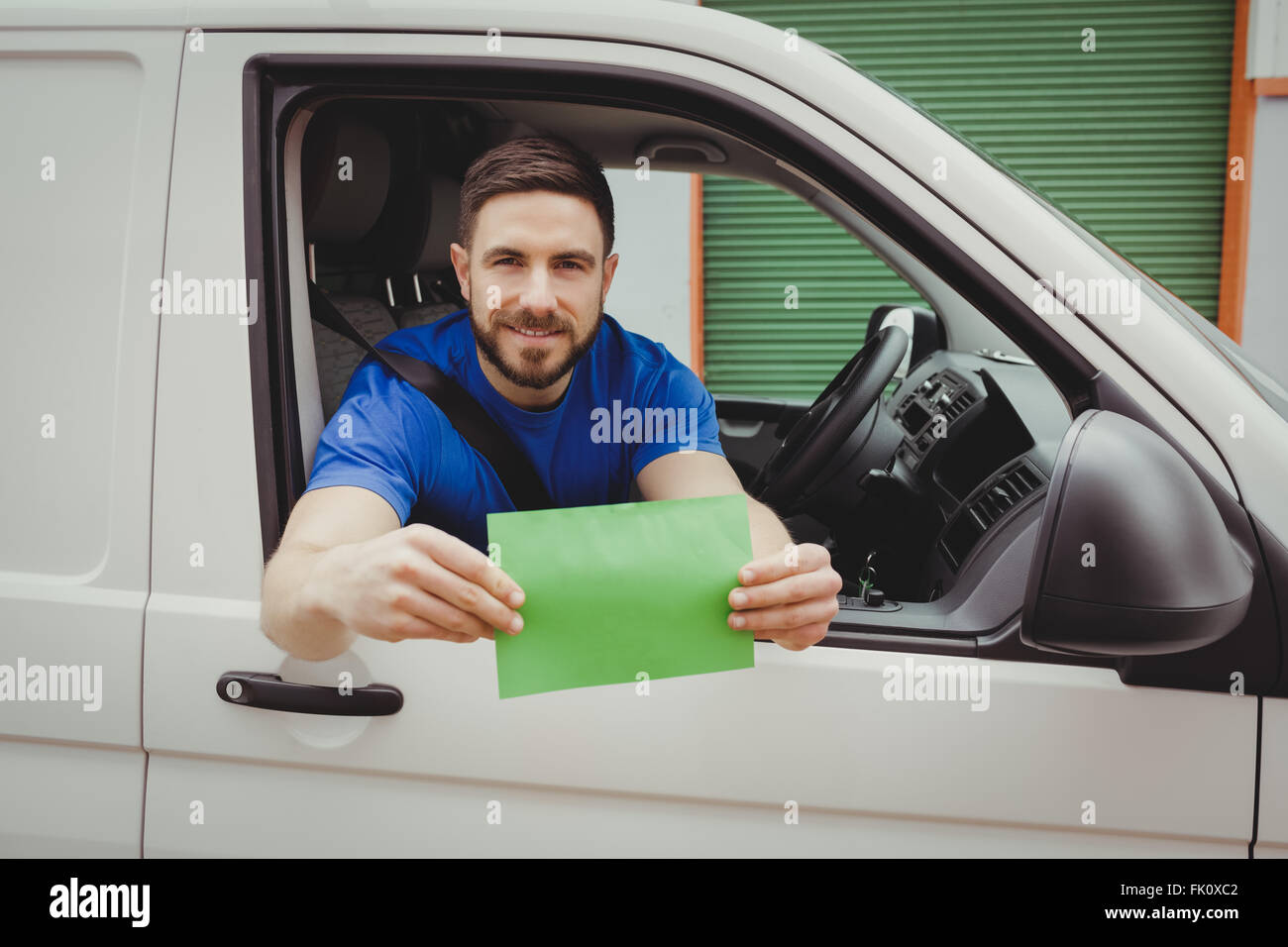 Man sitting in his van Stock Photo - Alamy