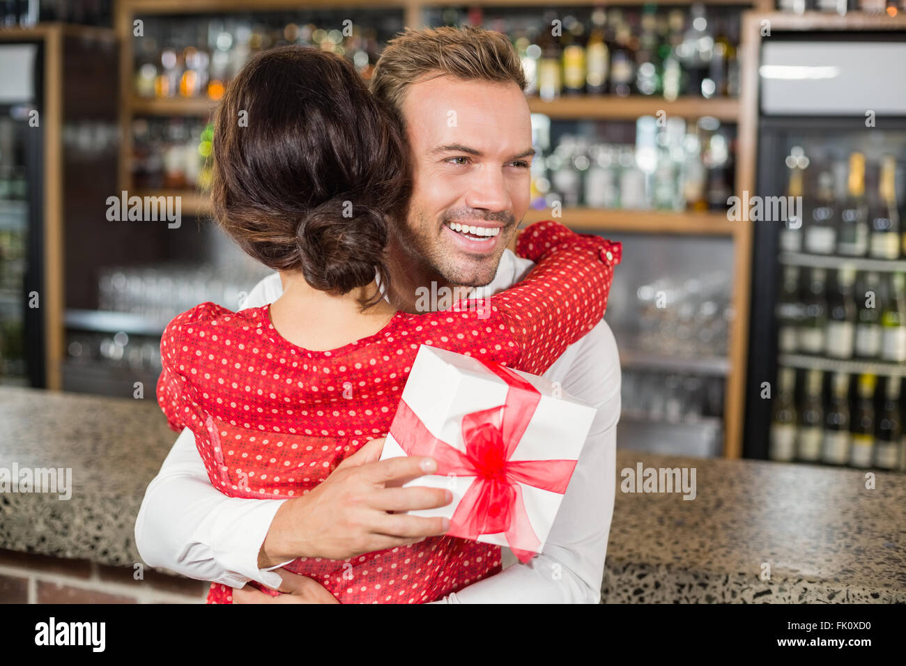A couple hugging in a bar Stock Photo - Alamy