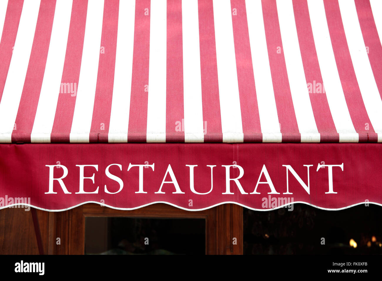 Striped french restaurant canopy in Paris france Stock Photo - Alamy