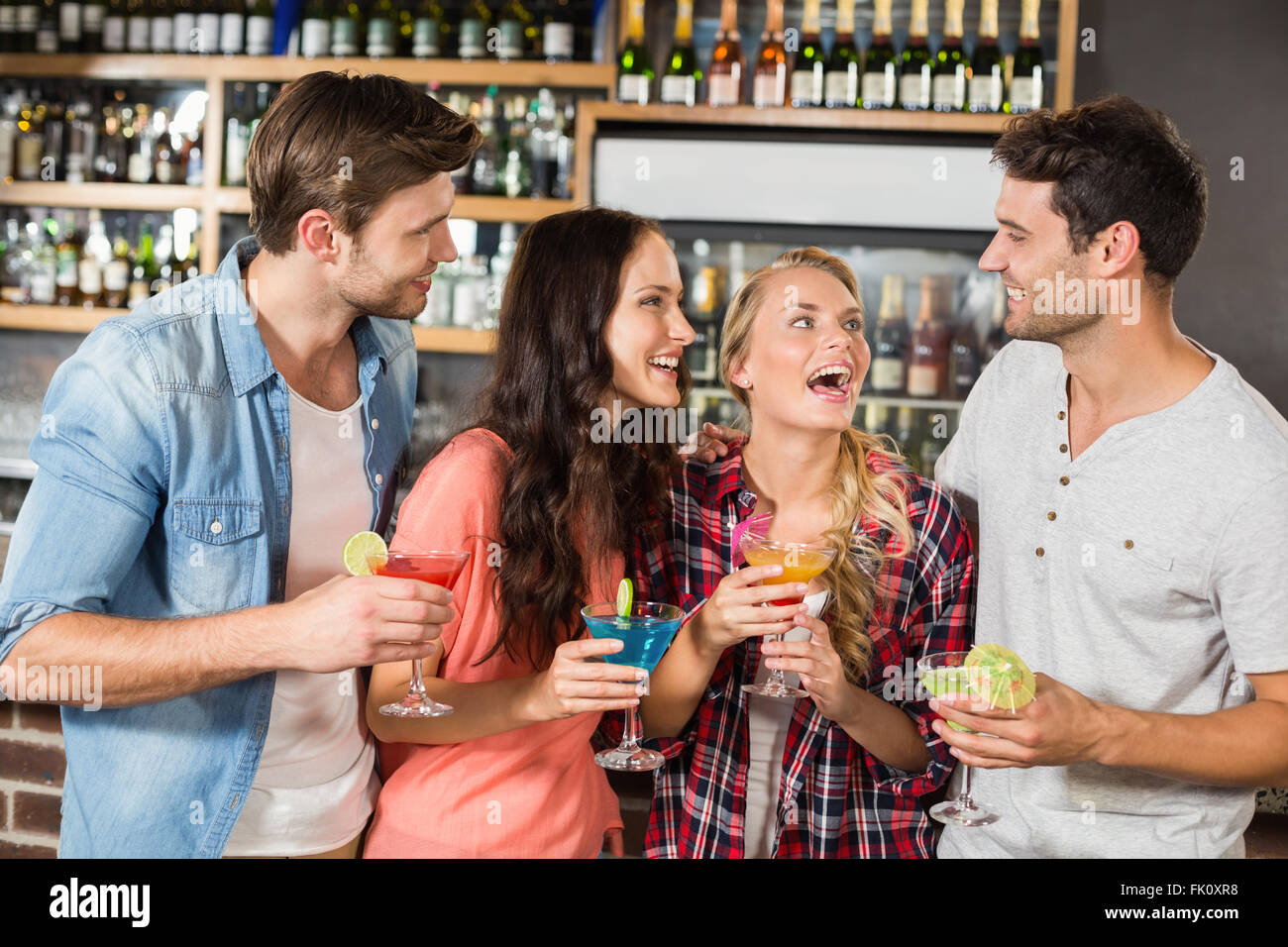 Friends toasting with cocktails Stock Photo - Alamy