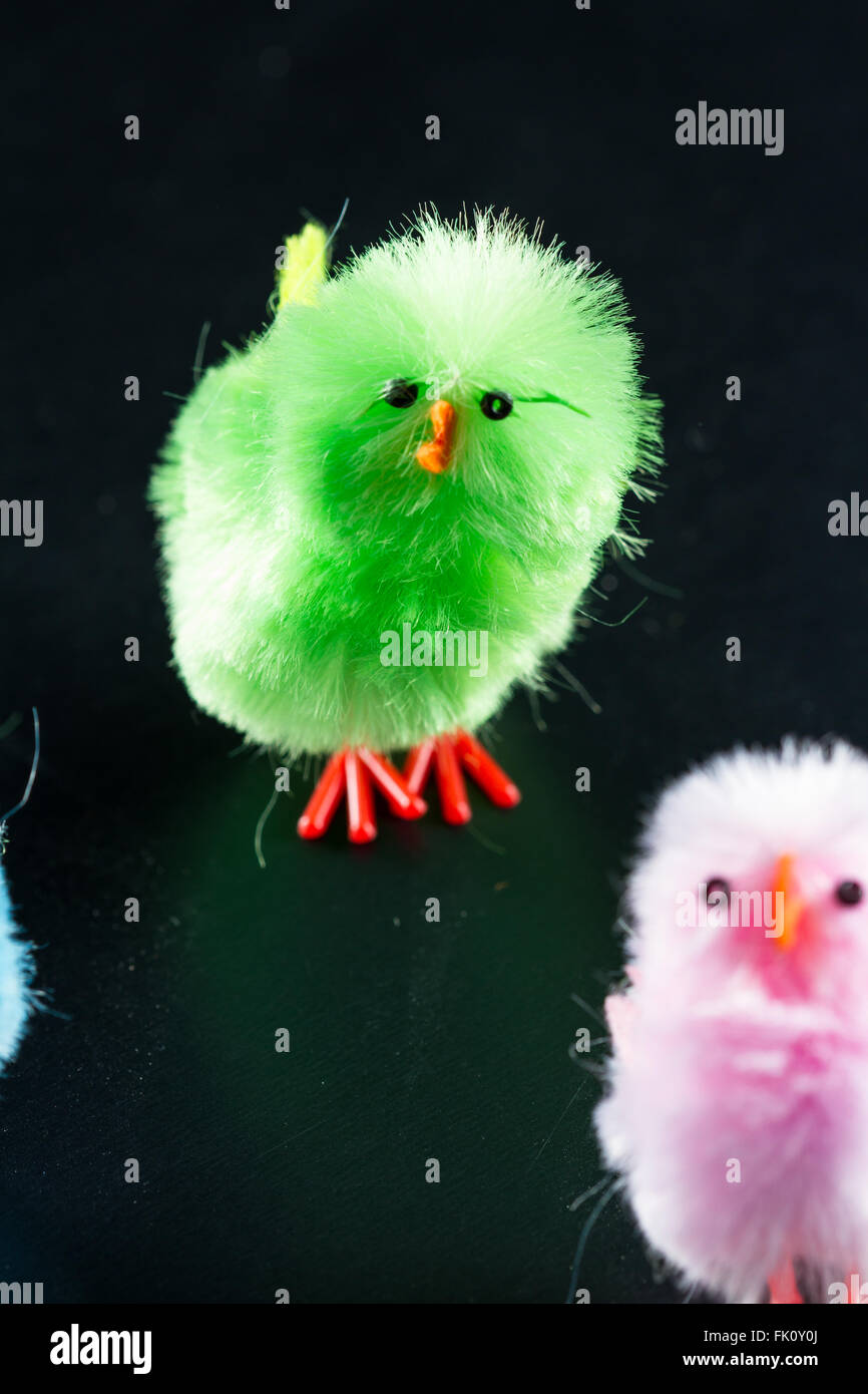 close up of a group of fuzzy chicks in pastel colors for a spring ...