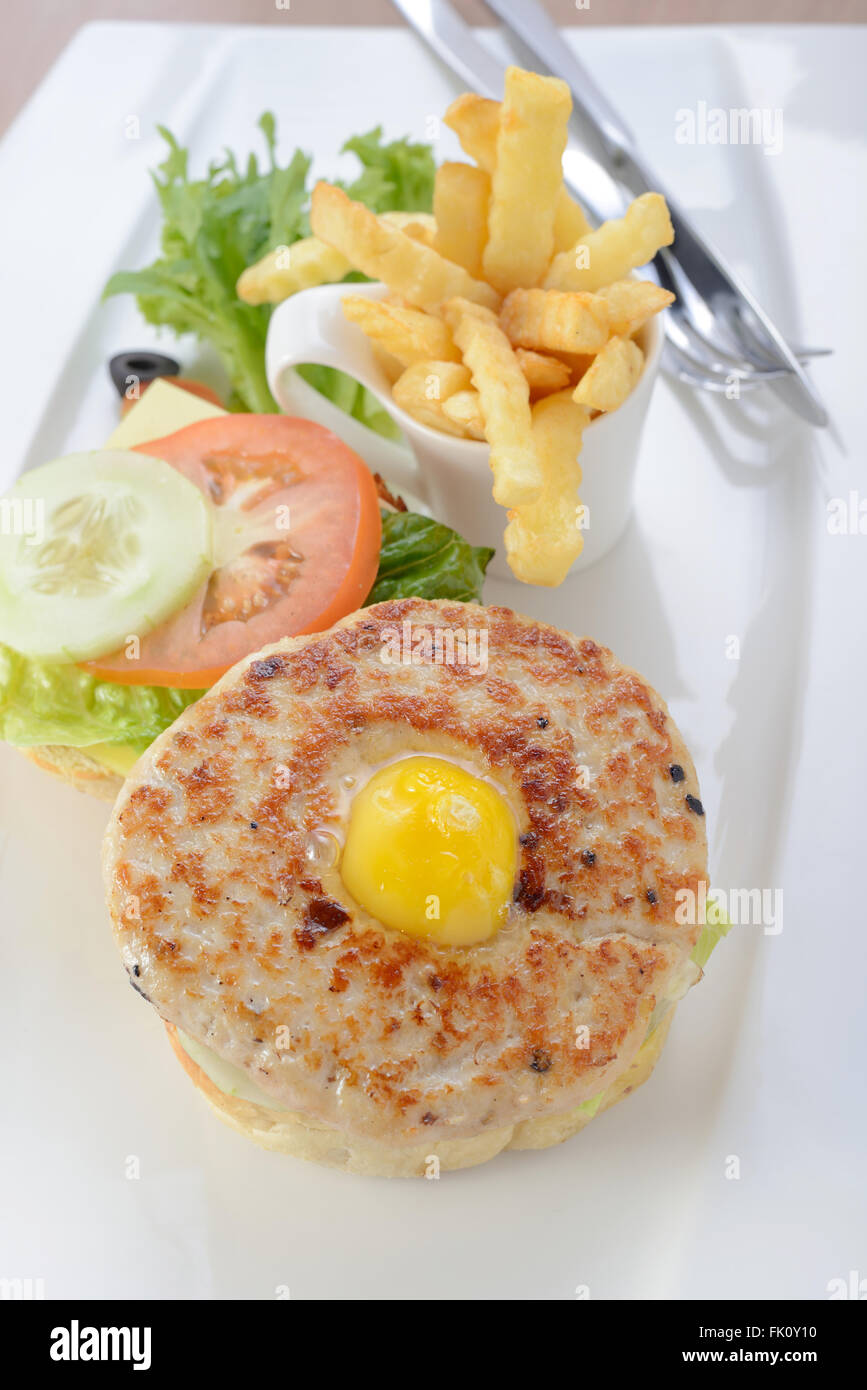 The Burger Ring with egg Stock Photo - Alamy