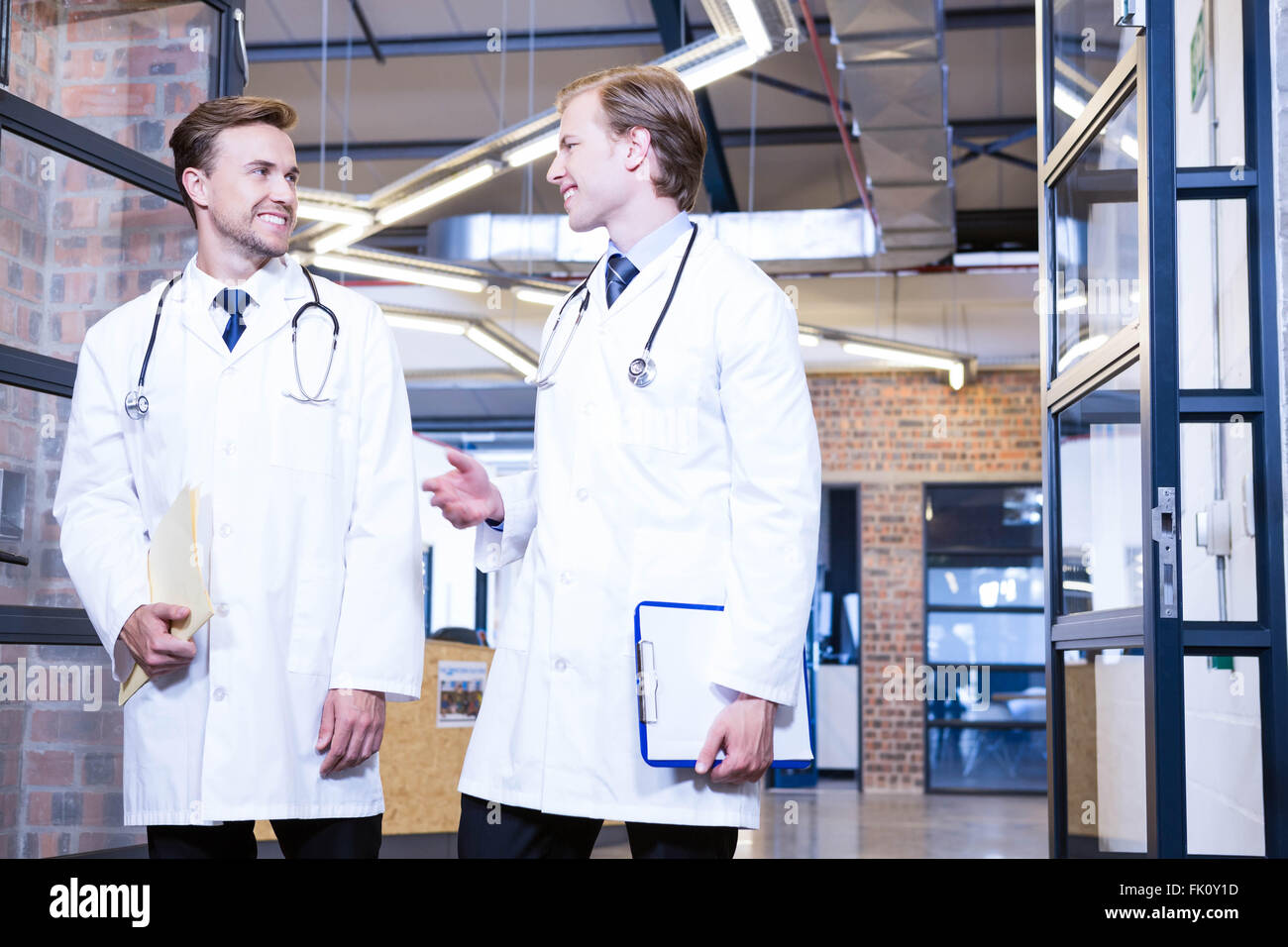 Doctors interacting with each other Stock Photo - Alamy