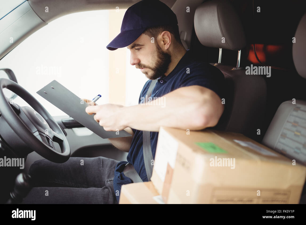 Male courier sitting in hi-res stock photography and images - Alamy