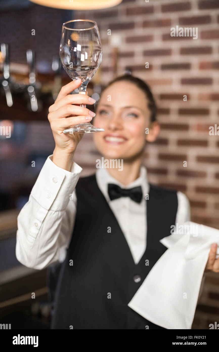 Barmaid holding wine glass hi-res stock photography and images - Alamy