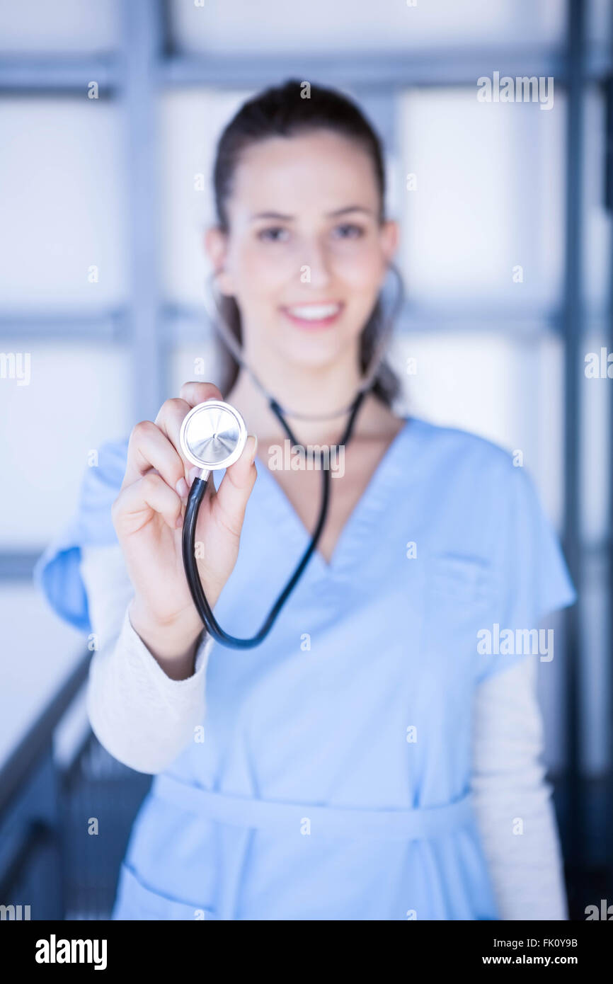 Portrait of female doctor showing stethoscope Stock Photo - Alamy