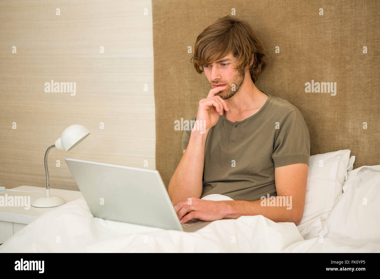 Handsome man using laptop Stock Photo - Alamy