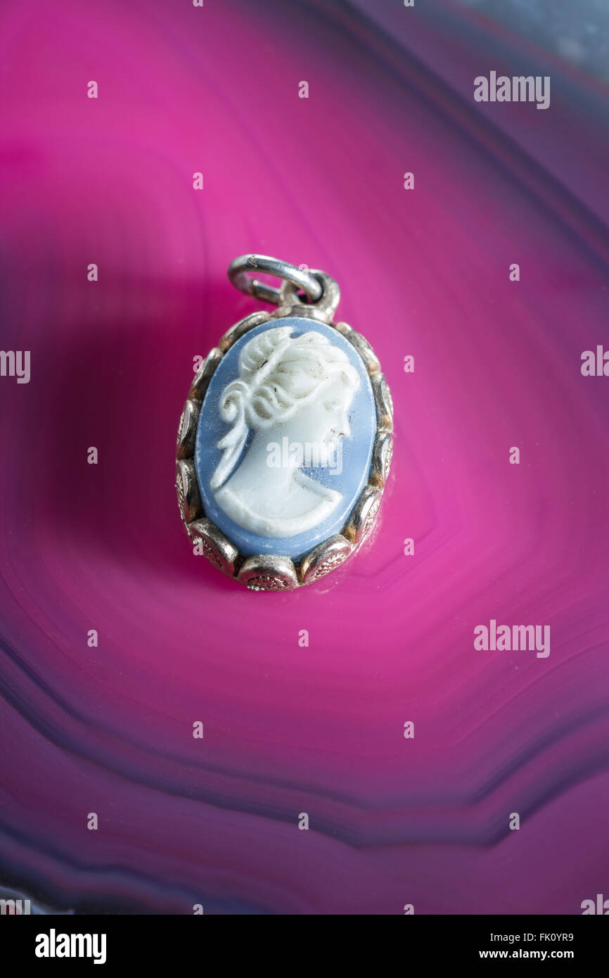 close up of a beautiful cameo on a vivid pink polished stone Stock ...