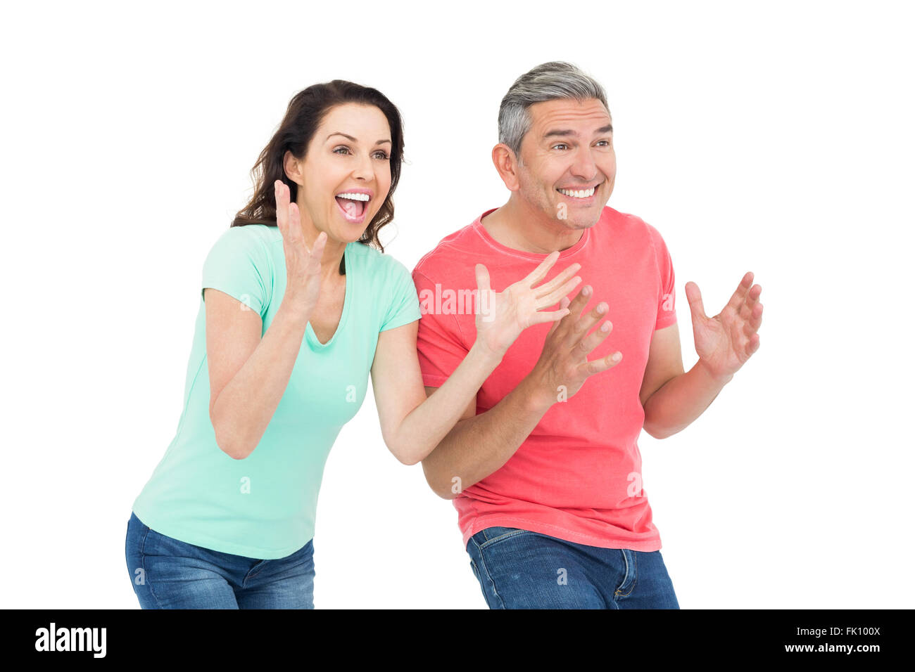 Excited couple cheering Stock Photo - Alamy