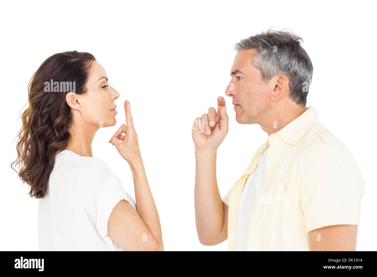 Focused couple gesturing Stock Photo - Alamy