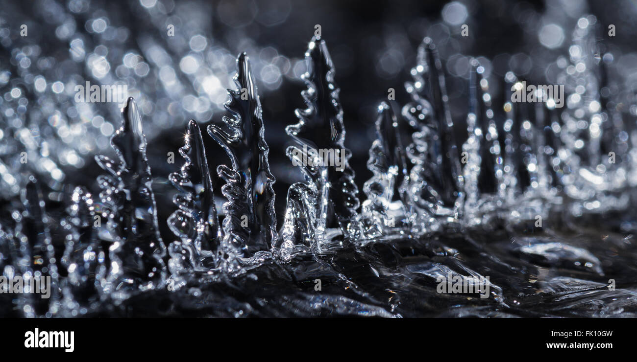 close up of sharp cool looking ice shards in beautiful figures on a ...