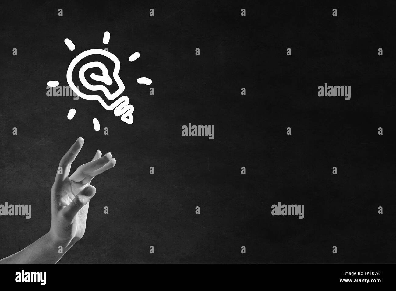 Male hand and chalk drawn light bulb as idea symbol Stock Photo - Alamy
