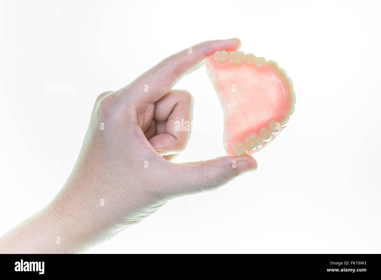 Dentures in hand hi-res stock photography and images - Alamy