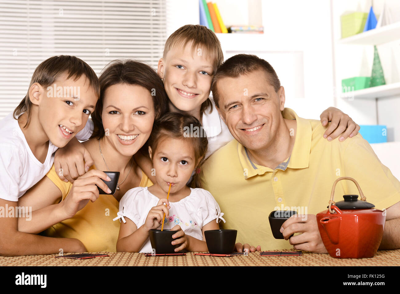 Family drinking tea Stock Photo - Alamy