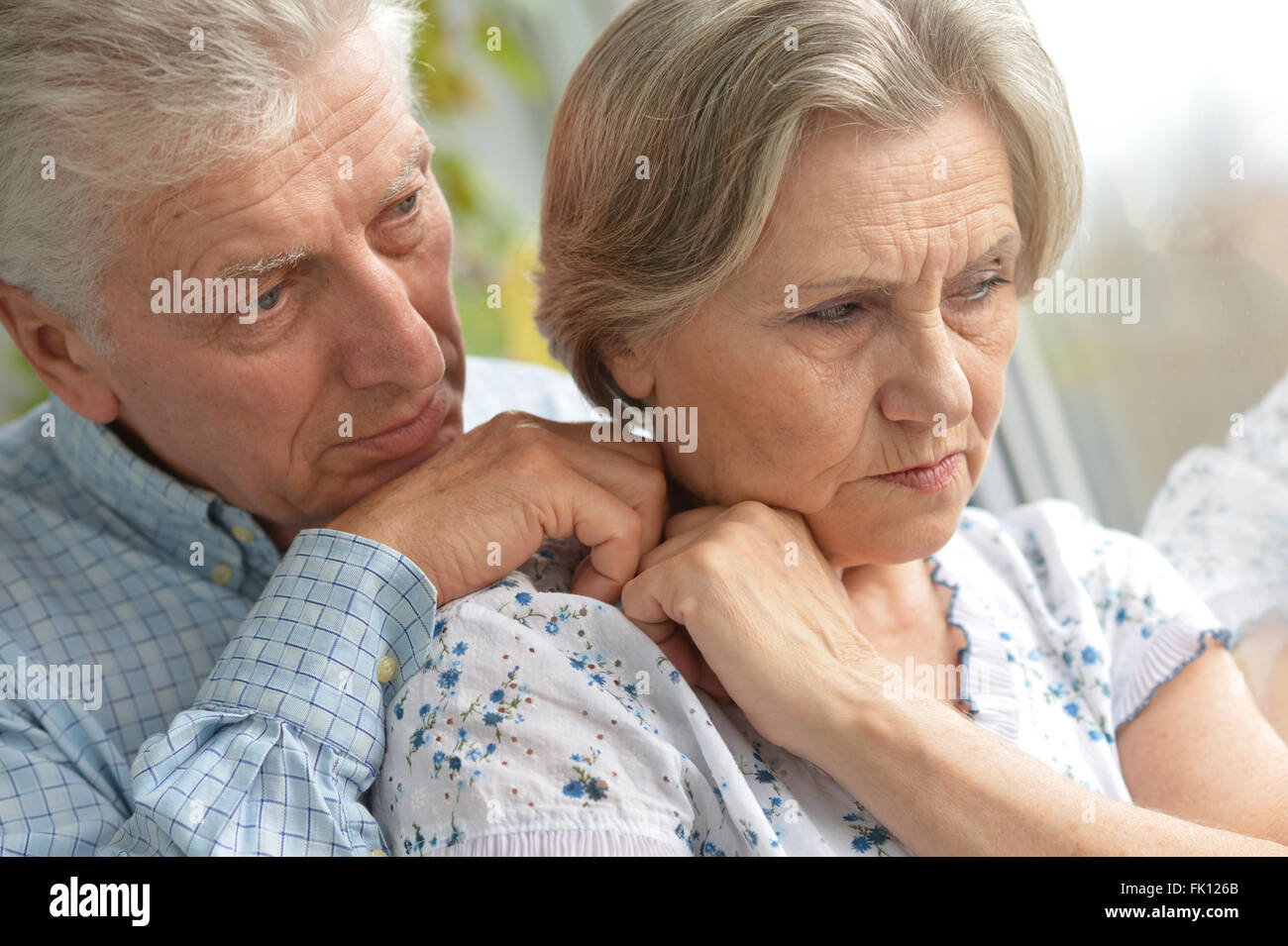 Sad elder couple Stock Photo - Alamy