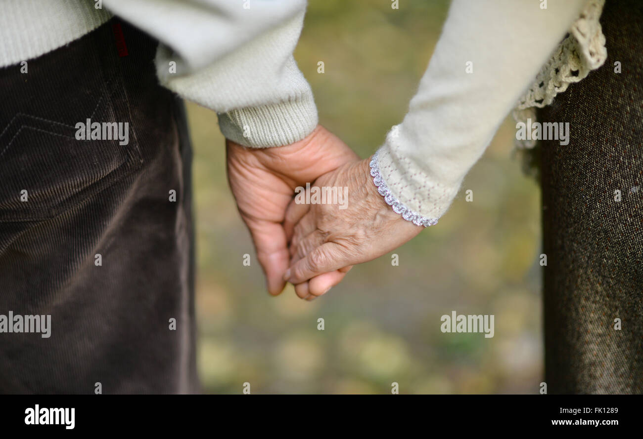 Hands held together Stock Photo - Alamy