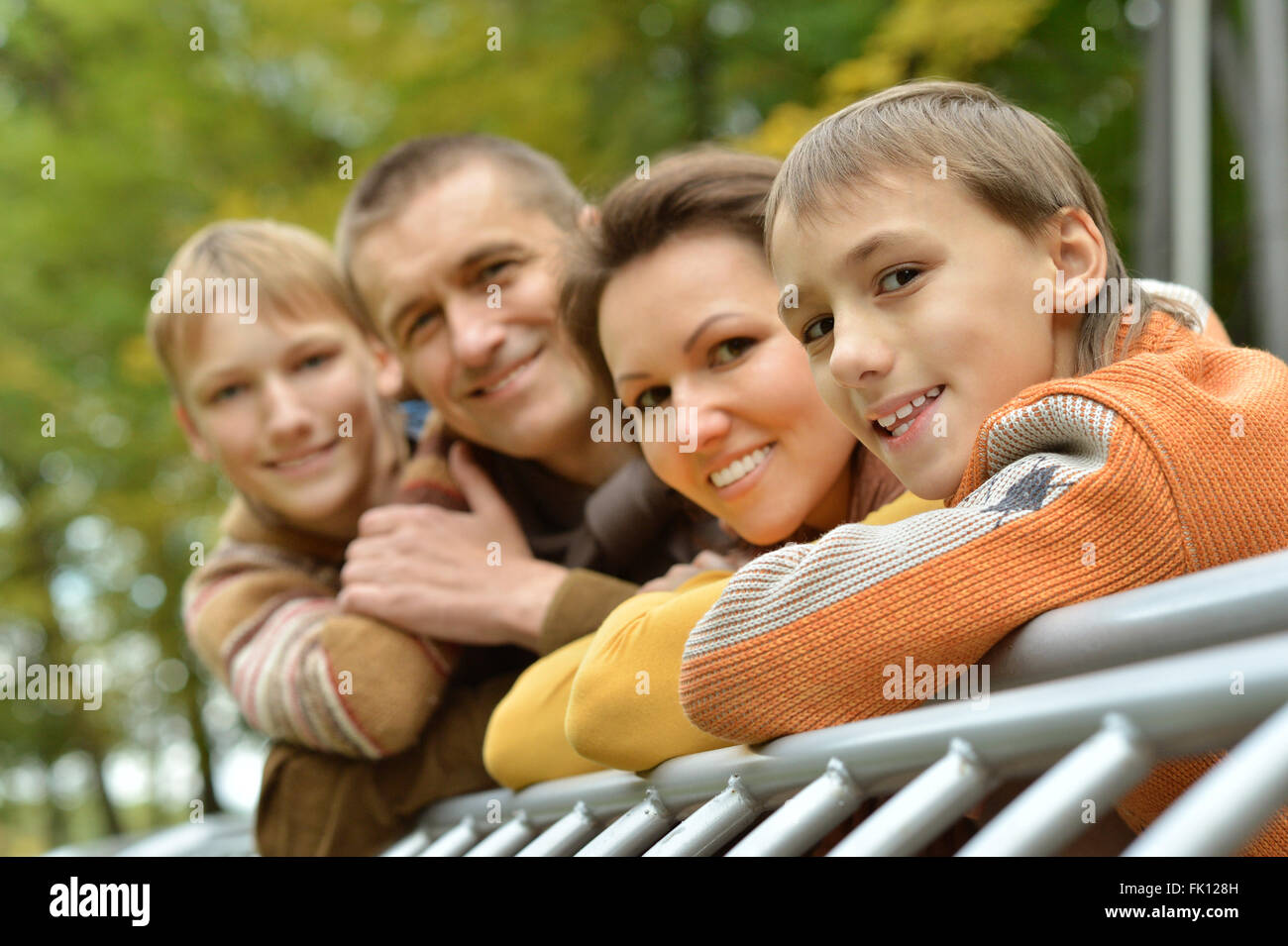 Portrait of family relaxing Stock Photo - Alamy
