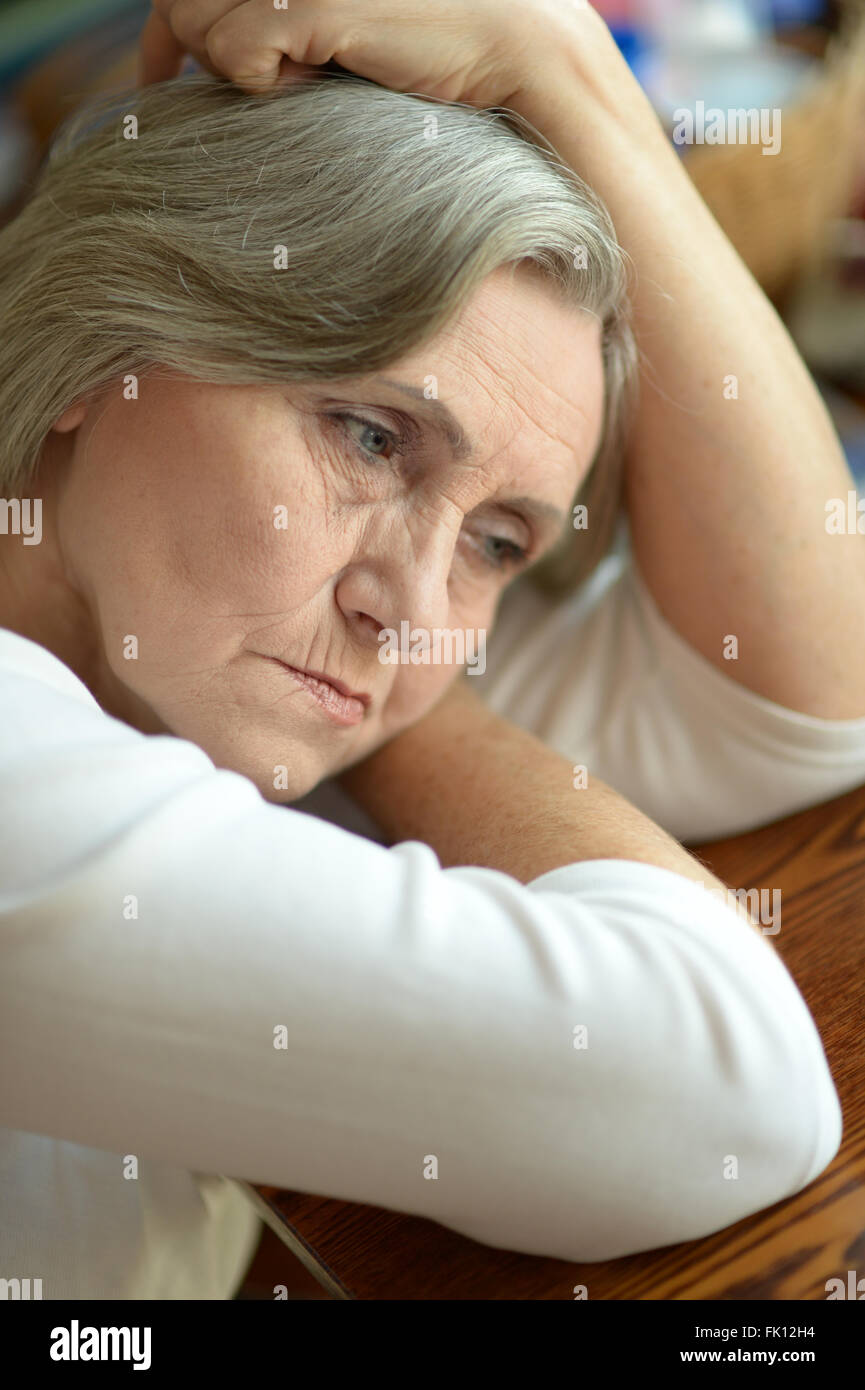 Sad senior woman Stock Photo - Alamy