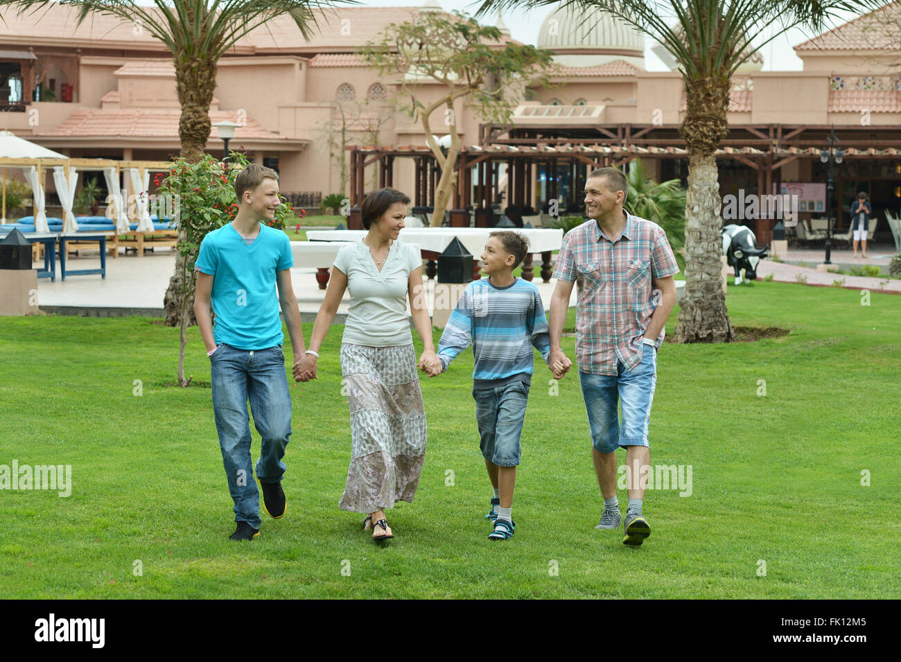 family in tropical ressort Stock Photo - Alamy