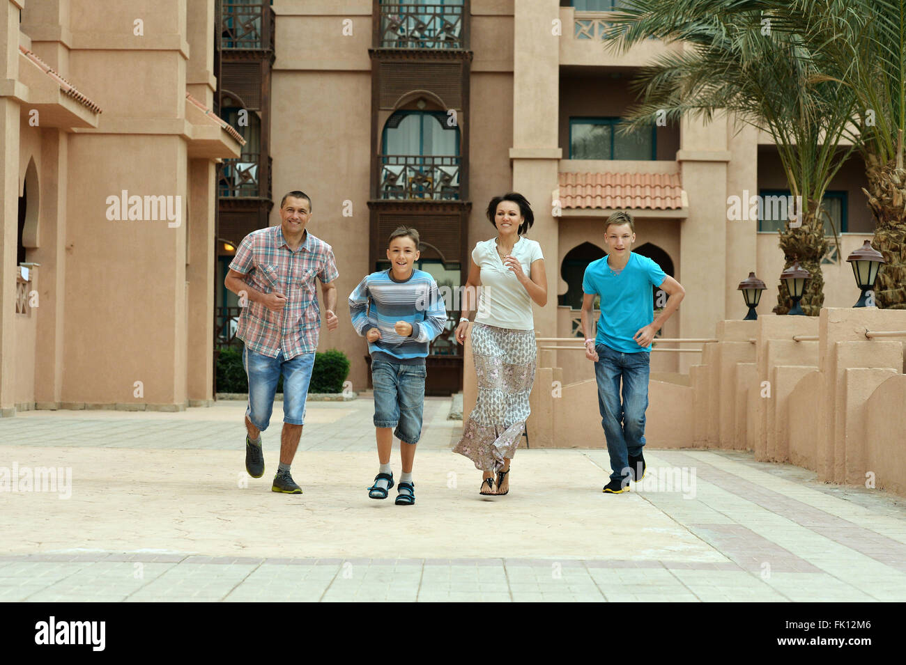 family in tropical ressort Stock Photo - Alamy