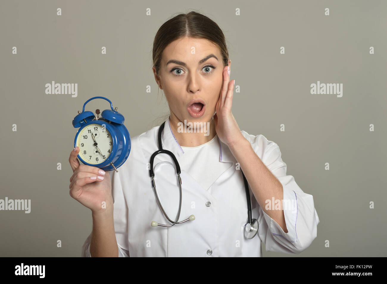 doctor with clock Stock Photo - Alamy