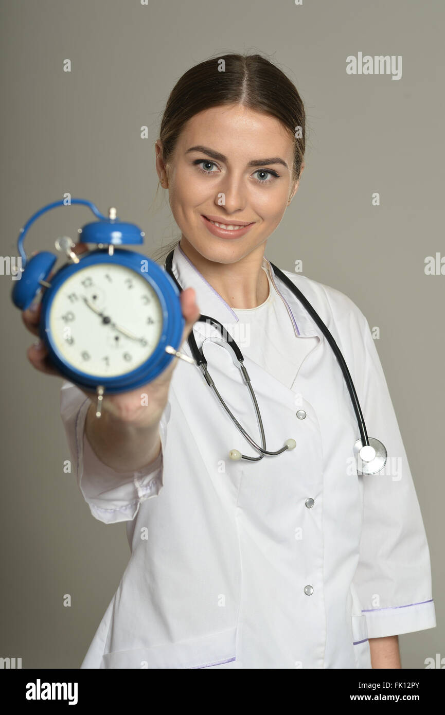 doctor with clock Stock Photo - Alamy