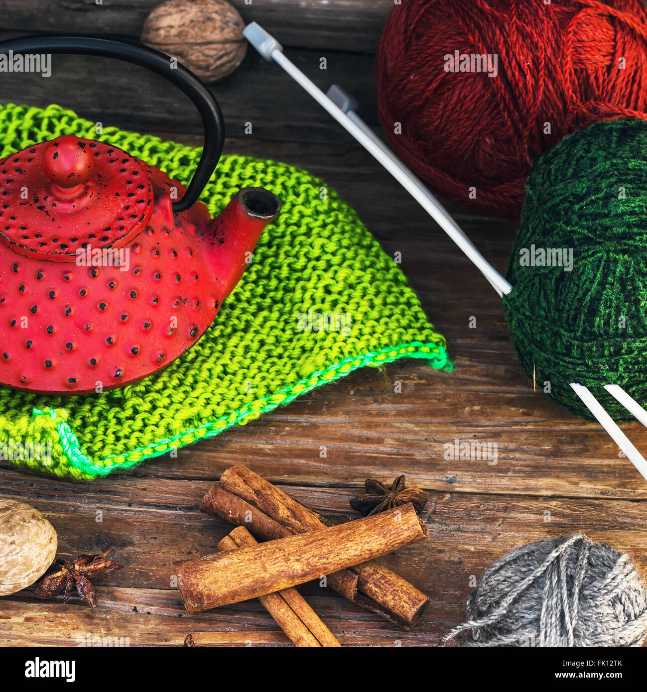 Warming tea in the kettle,balls of wool and spices Stock Photo - Alamy