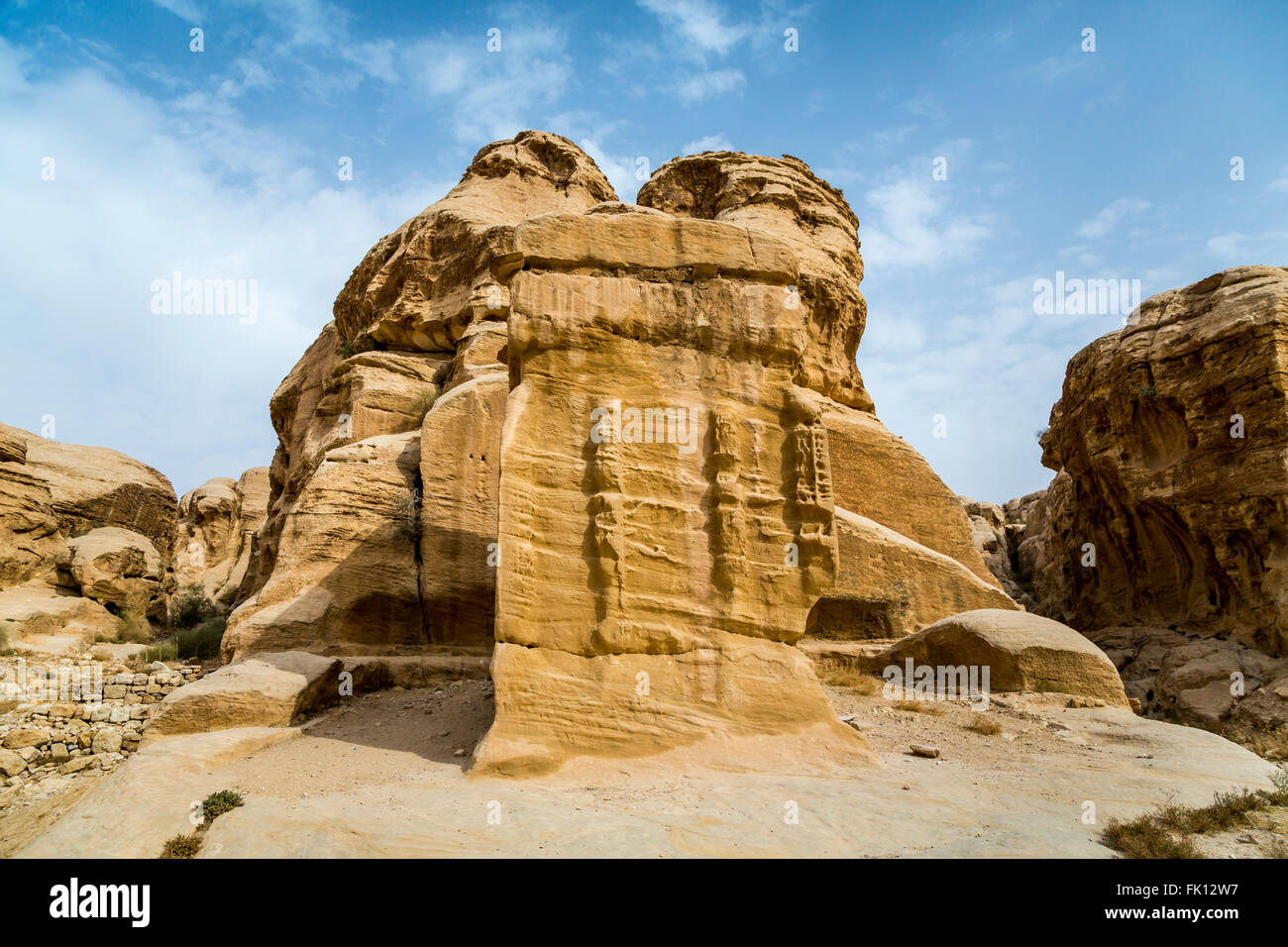 Carved tombs and caves in the Siq passage to the entrance of Petra ...