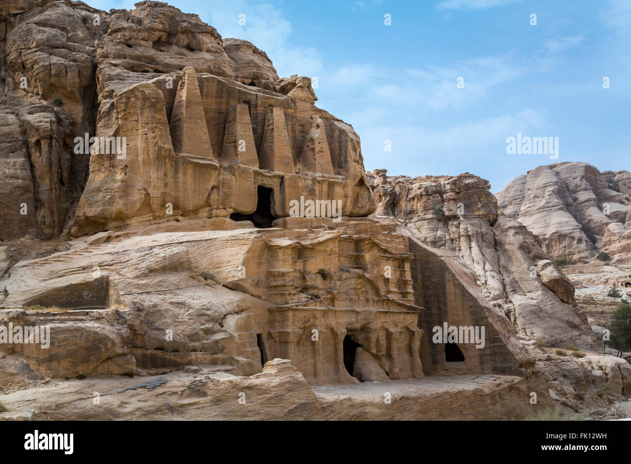 Carved tombs and caves in the Siq passage to the entrance of Petra ...