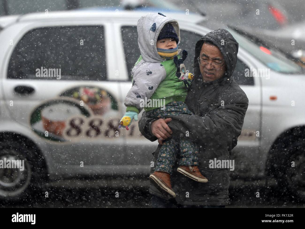 Harbin, China's Heilongjiang Province. 5th Mar, 2016. A man holding a ...
