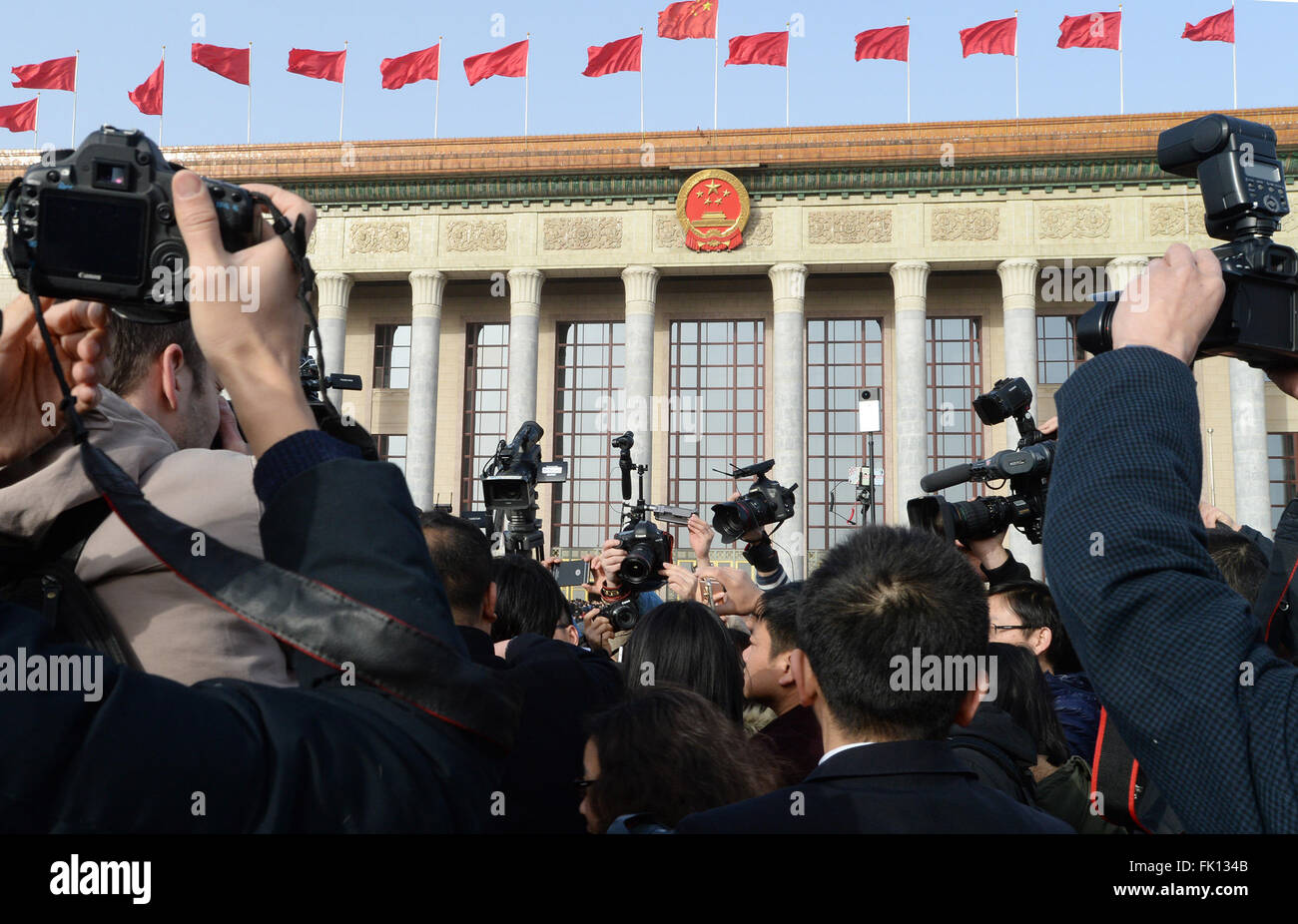 Beijing, China. 5th Mar, 2016. Journalists work outside the Great Hall ...