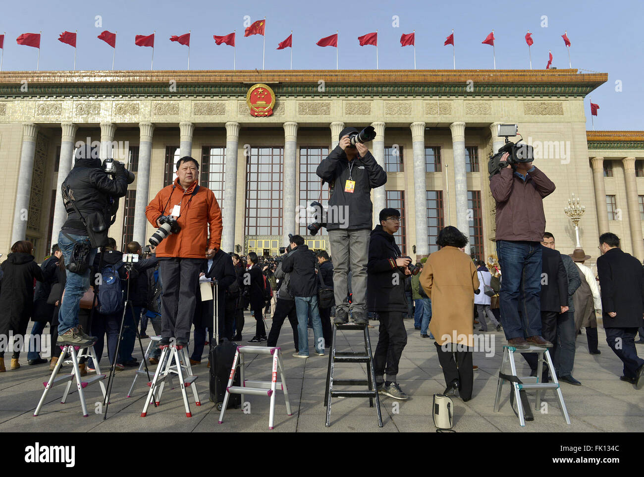 Beijing, China. 5th Mar, 2016. Journalists work outside the Great Hall ...