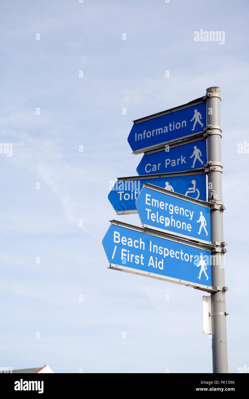 Blue Beach Side Road Signs and a blue sky Stock Photo - Alamy