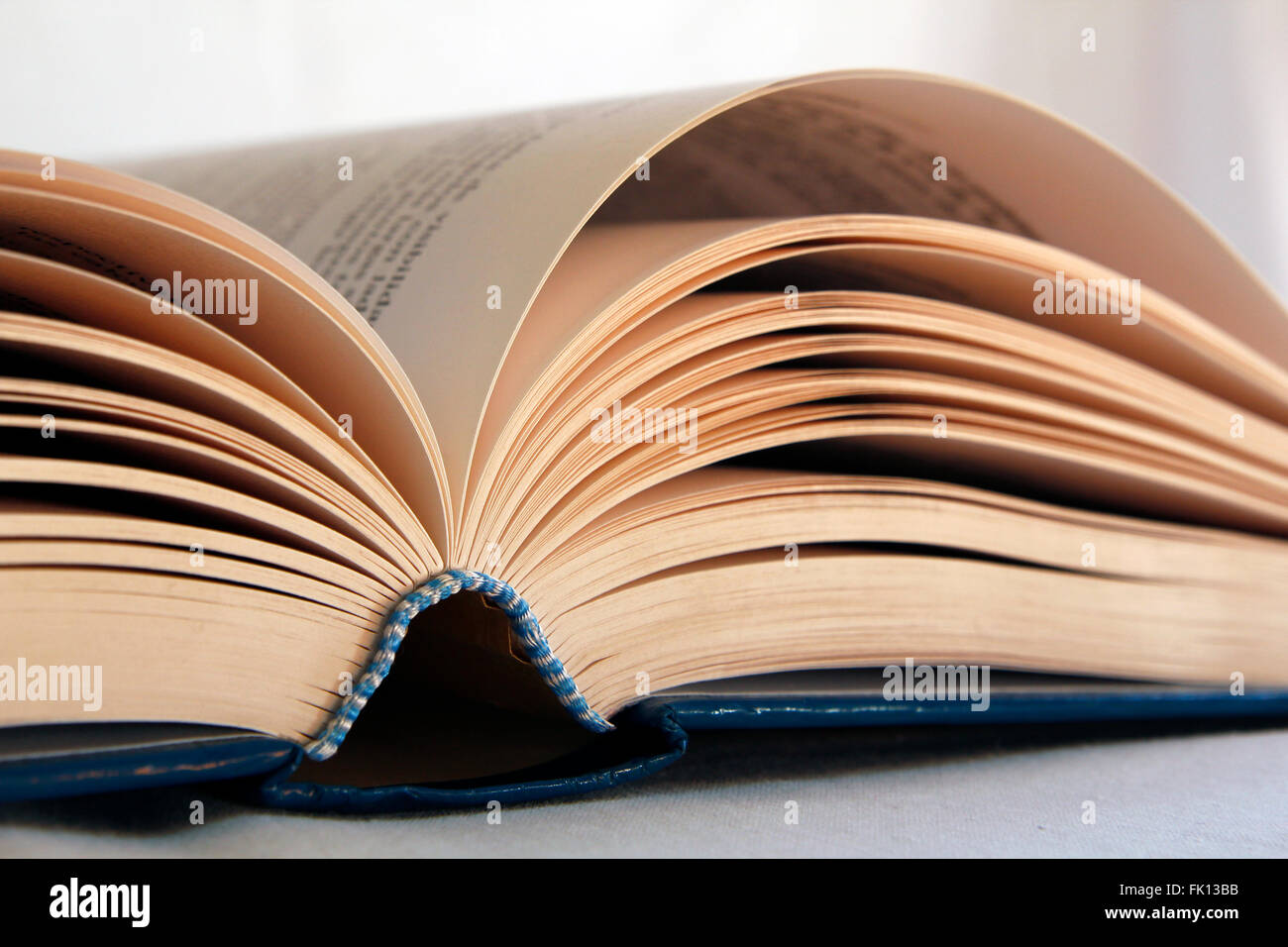 Open book close up, blue cover Stock Photo - Alamy